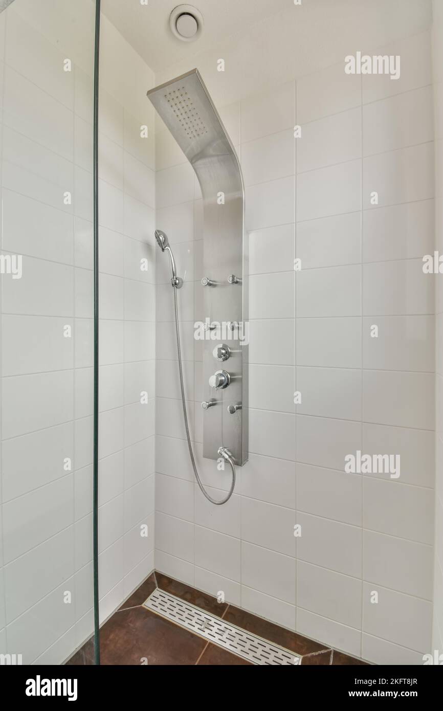 Interior of a modern shower with white walls Stock Photo - Alamy
