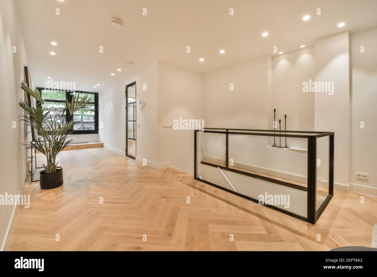 Interior passage way with parquet floor in modern house Stock Photo - Alamy