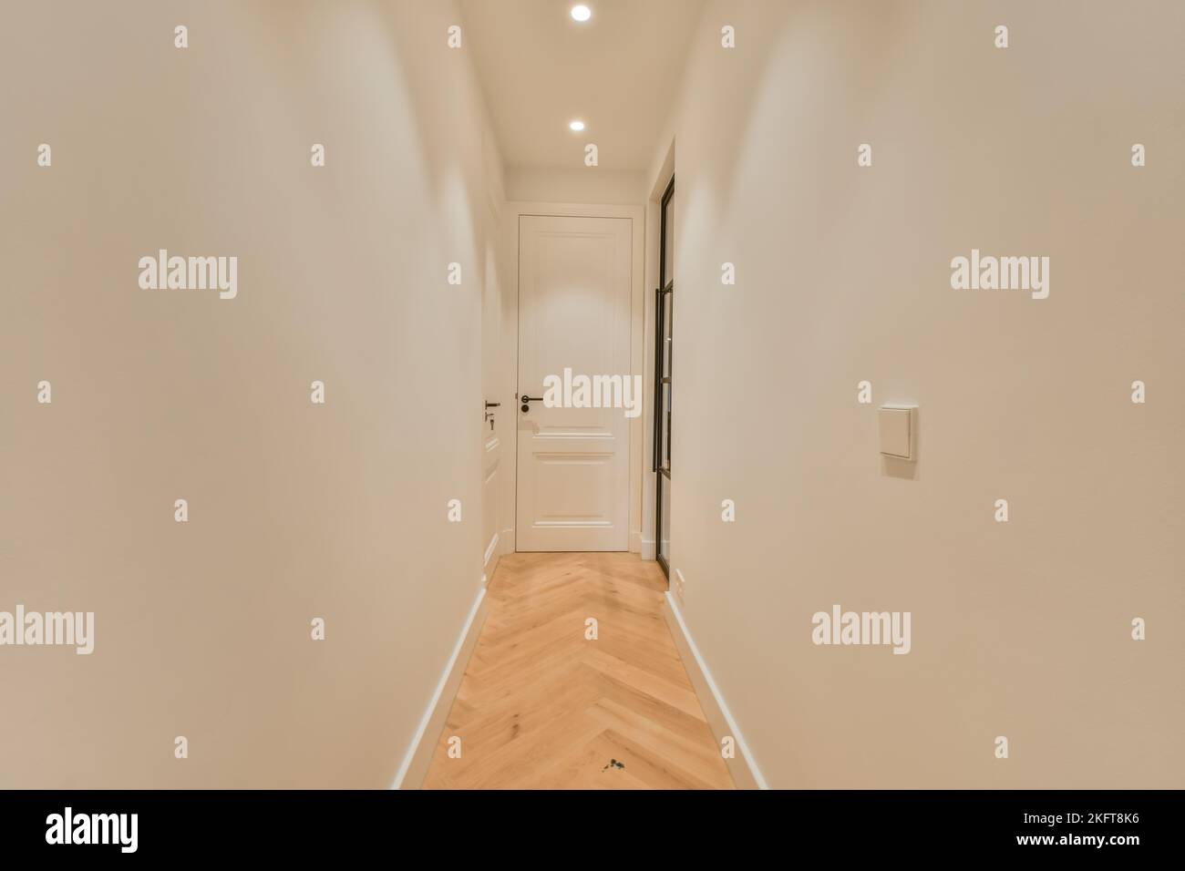 Interior passage way with parquet floor in modern house Stock Photo - Alamy