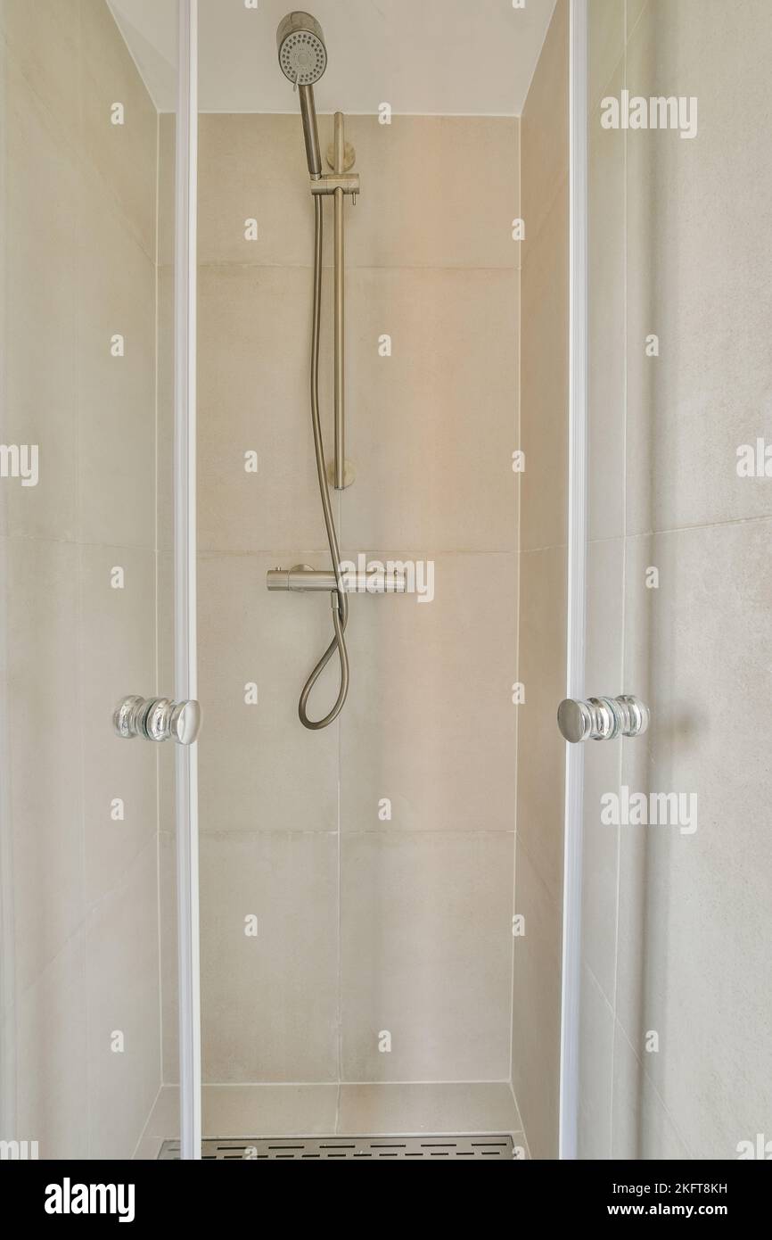 Interior of a modern shower with white walls Stock Photo - Alamy