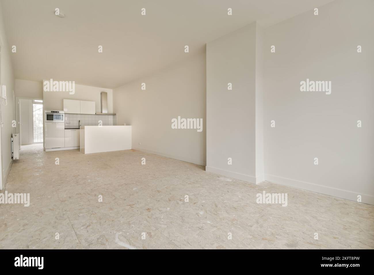 Interior of spacious open plan flat with modern kitchen and empty ...