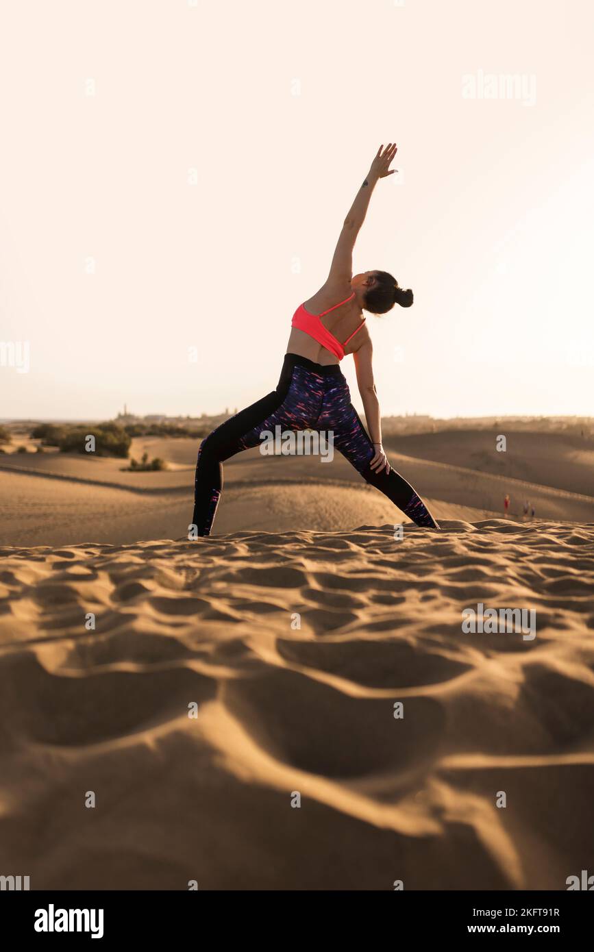 Woman raising arms side view hi-res stock photography and images - Alamy