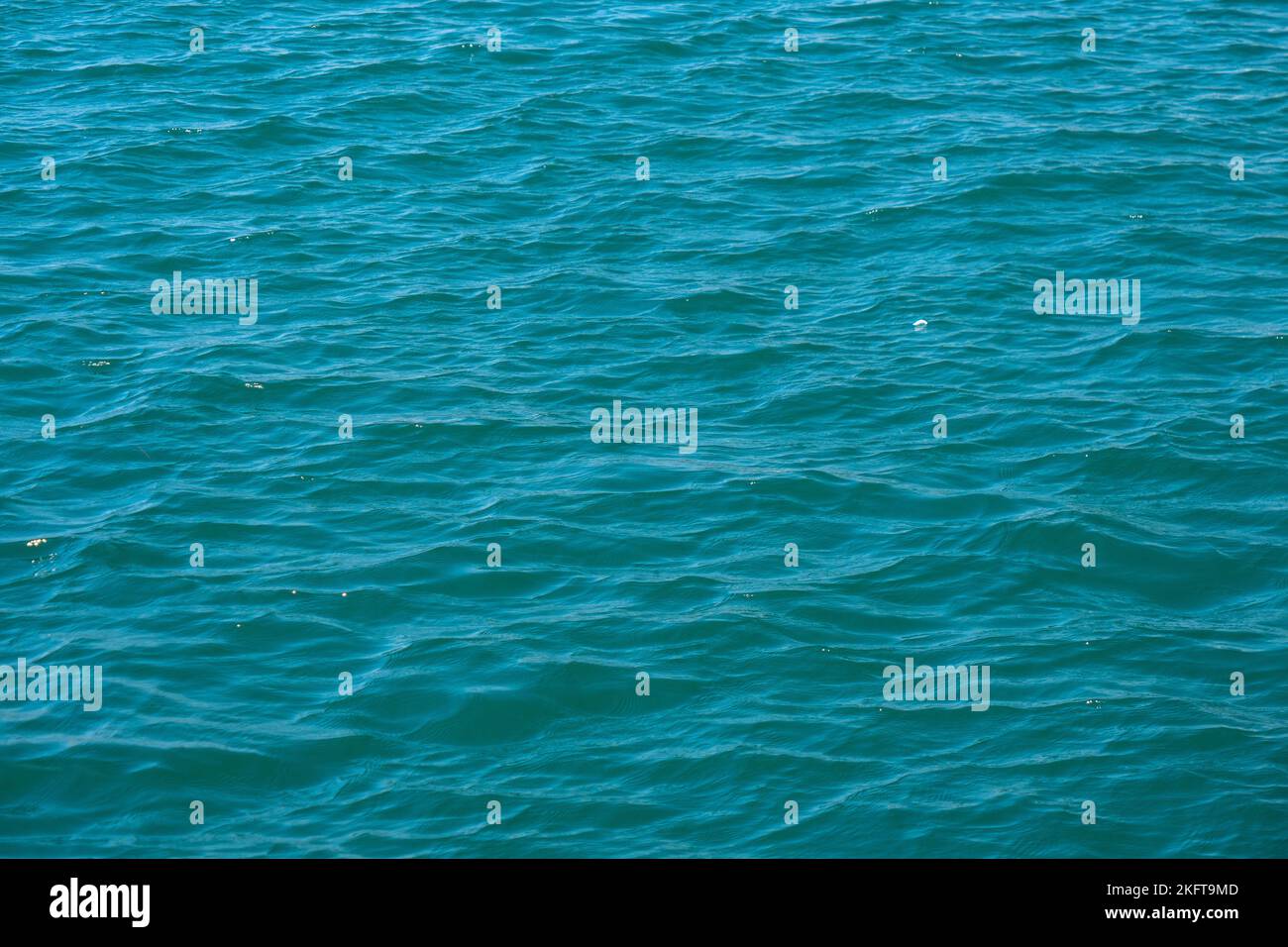 An aerial top view shot of the ocean surface with small waves Stock ...