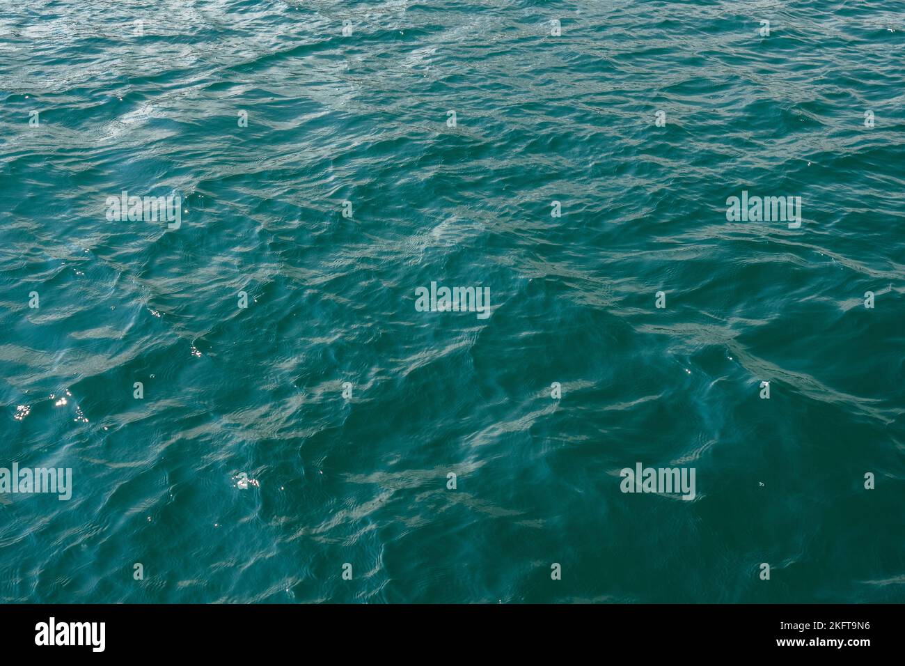 An aerial top view shot of the ocean surface with small waves Stock ...