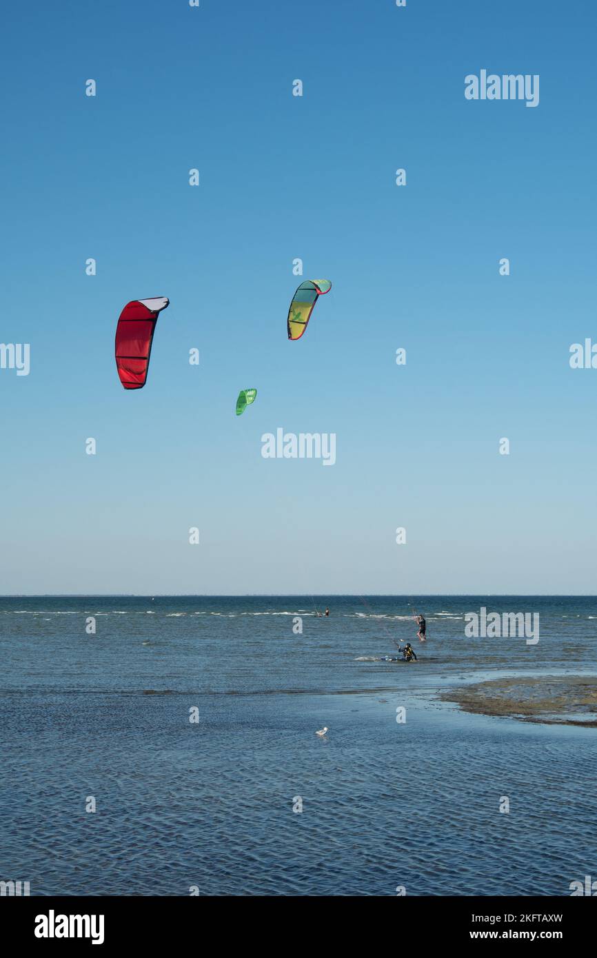 Vertical photo.Water sports like kitesurfing, kiteboarding ...