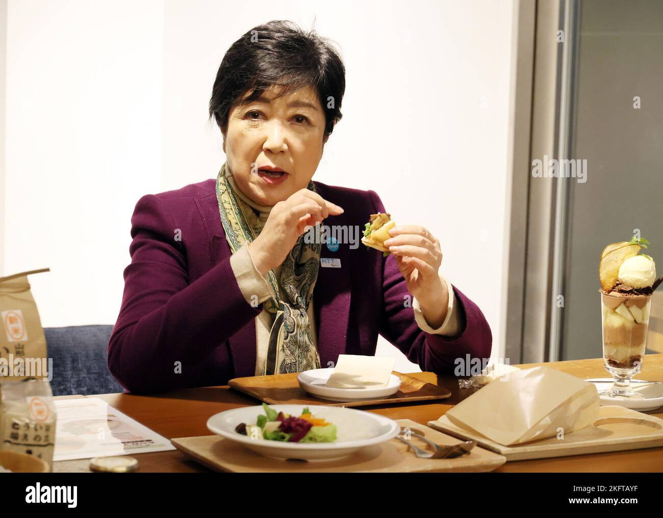 Tokyo, Japan. 20th Nov, 2022. Tokyo Governor Yuriko Koike eats a burger ...