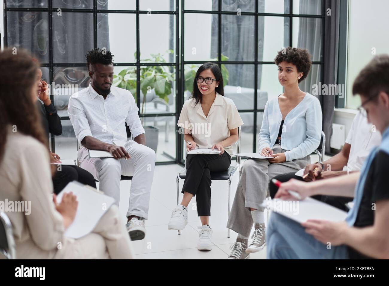 Business lecture. Happy executives , listening his speech in boardroom ...