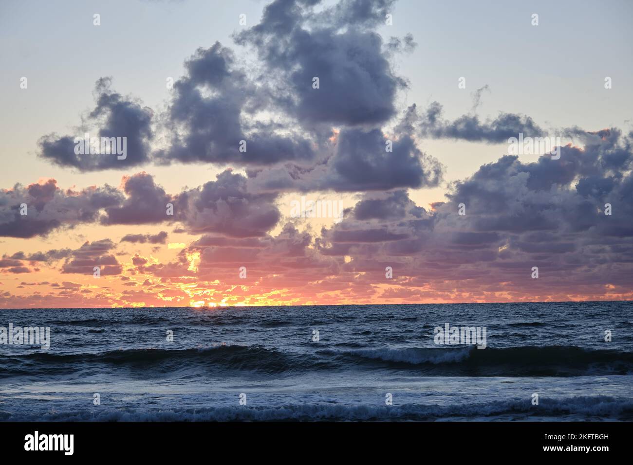 Dramatic summer sunset sky and tropical sea at dusk. Beach sand, sea ...
