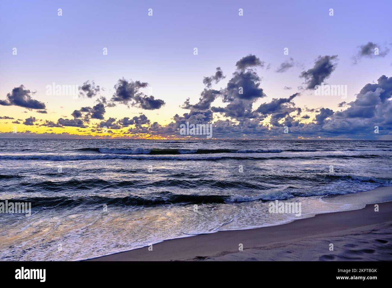 Dramatic summer sunset sky and tropical sea at dusk. Beach sand, sea ...