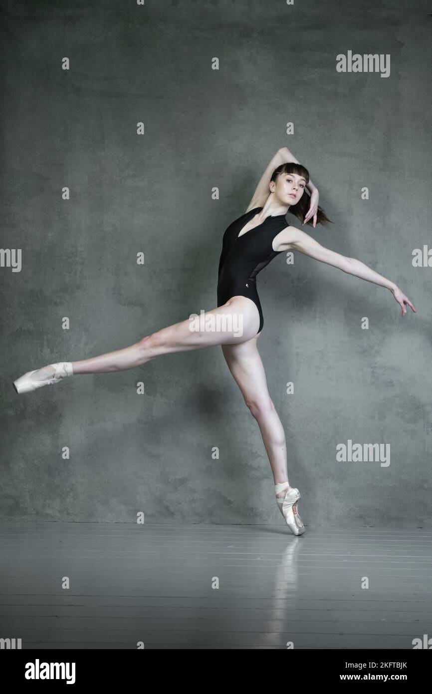 Ballerina with long legs in elegant ballet pose in the photo shoot ...