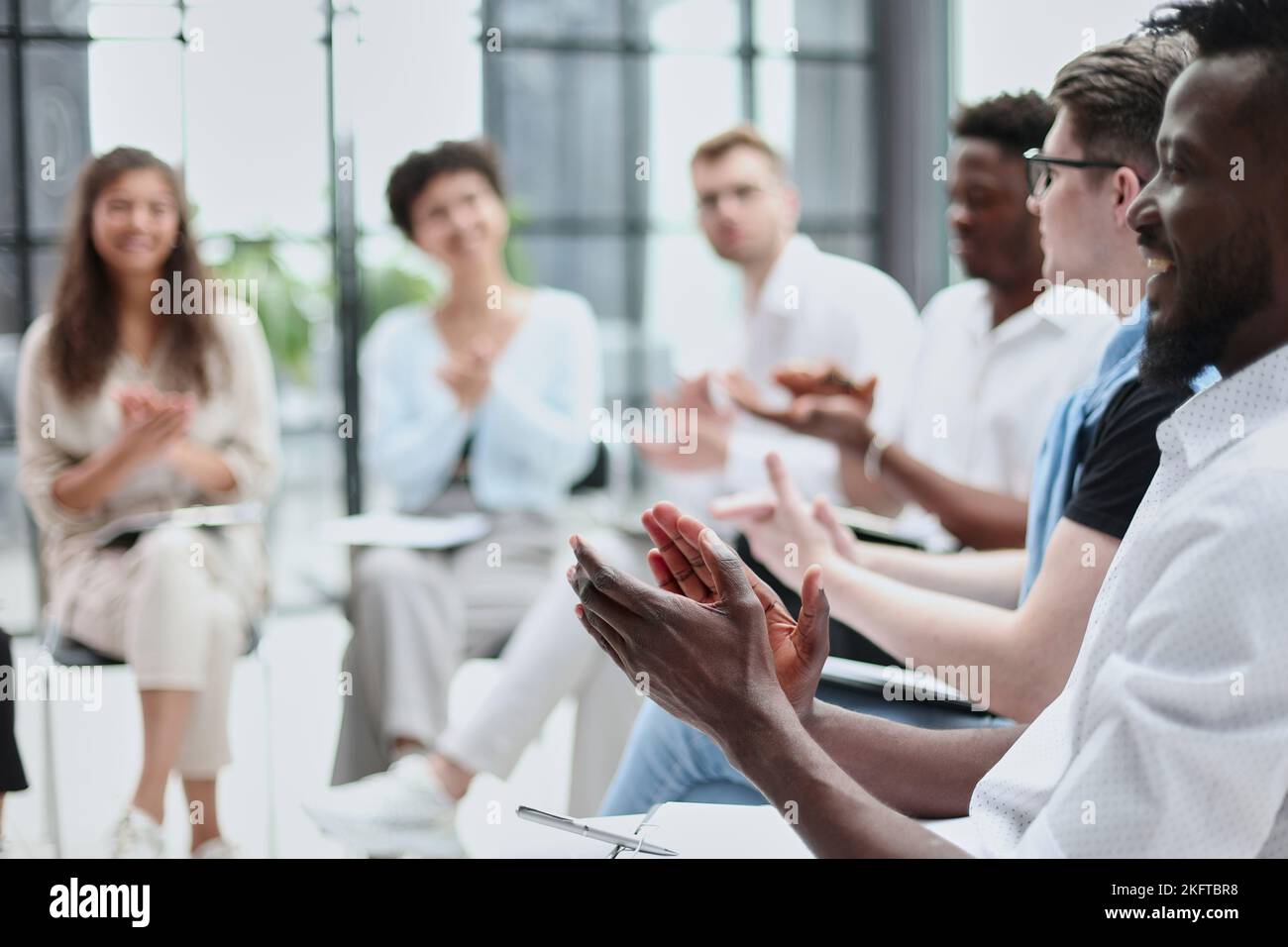 Audience clapping at business seminar, looking at each other Stock ...