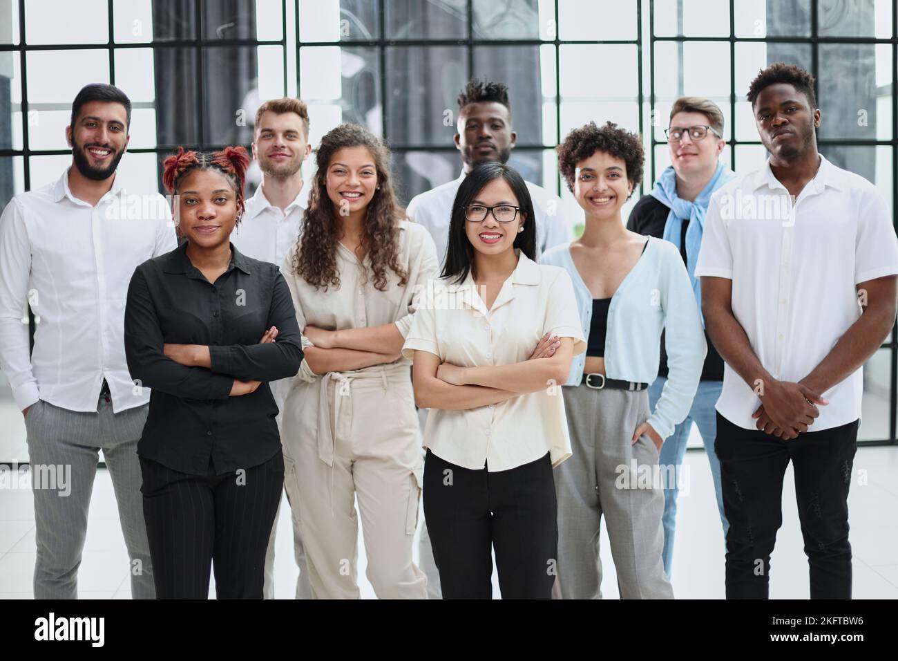 Business team formed of young businessmen standing Stock Photo - Alamy
