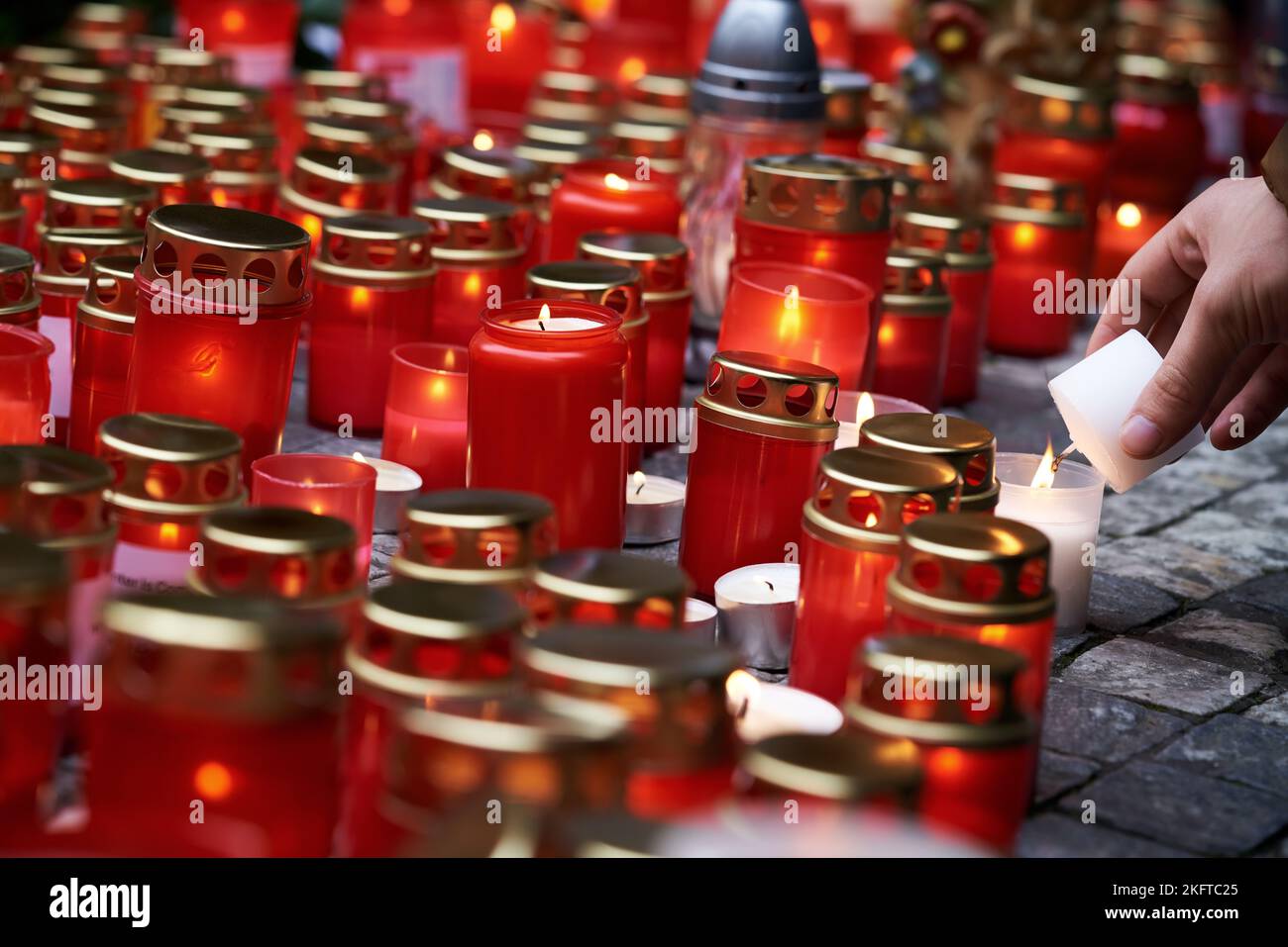 Hand lighting a candle at the anniversary of Czech Velvet Revolution on ...