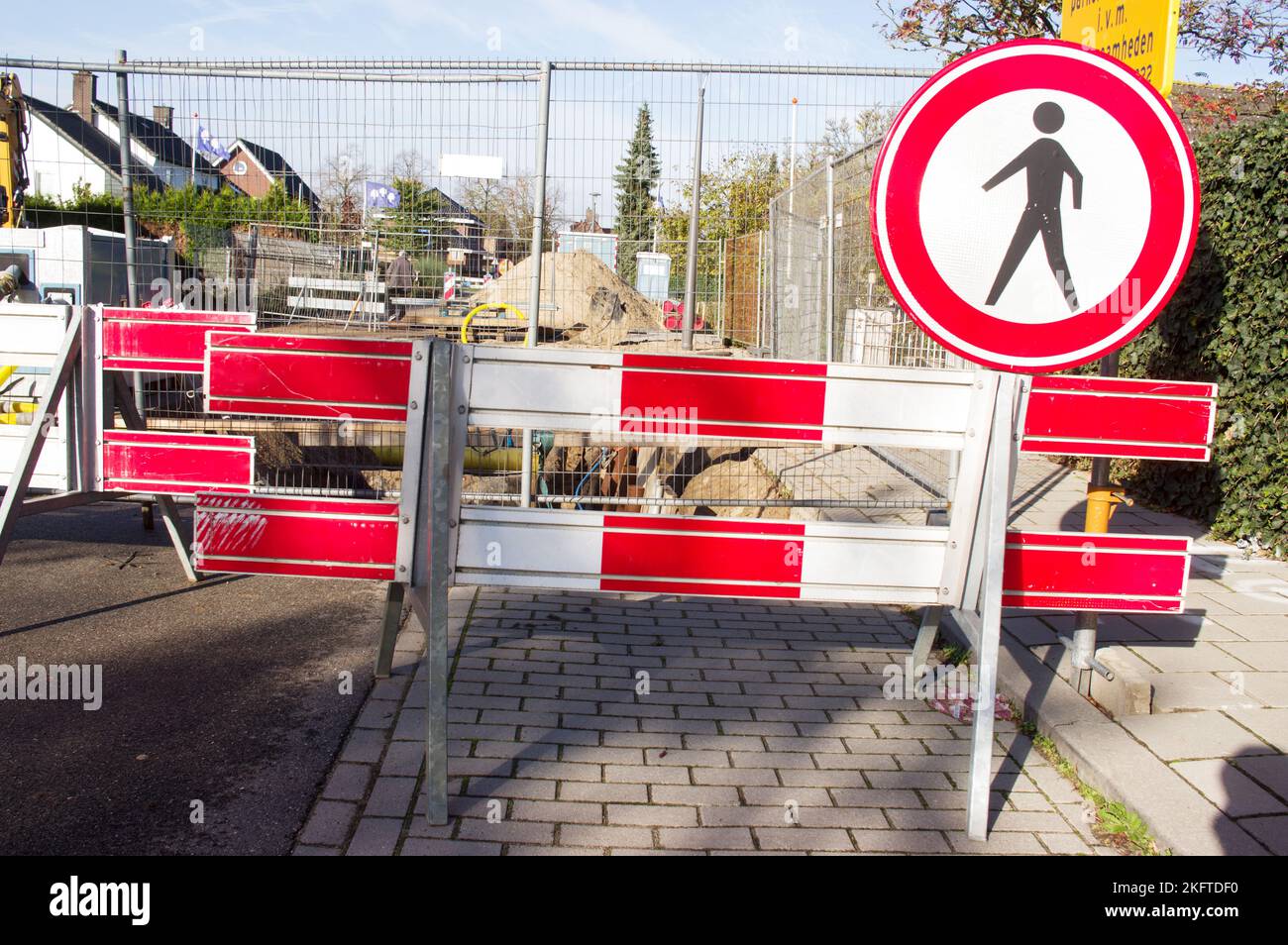 Work site closed with barriers and sign for pedestrians for roadworks ...