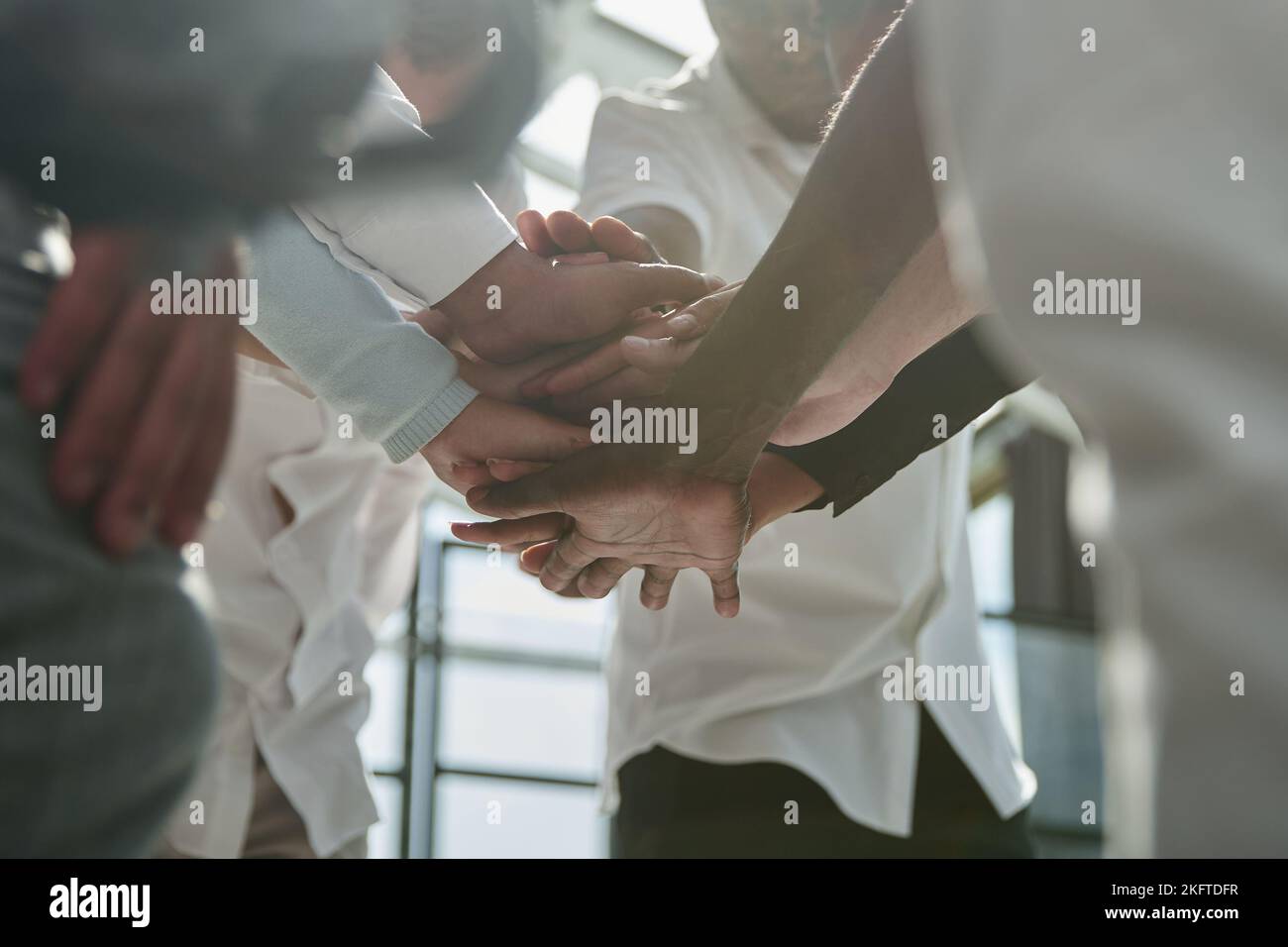 Group young creative people in smart casual wear smiling and arms ...