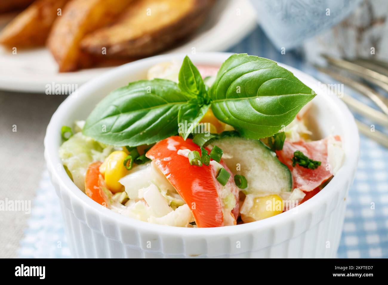 Vegetable salad decorated with basil leaf. Healthy food Stock Photo - Alamy