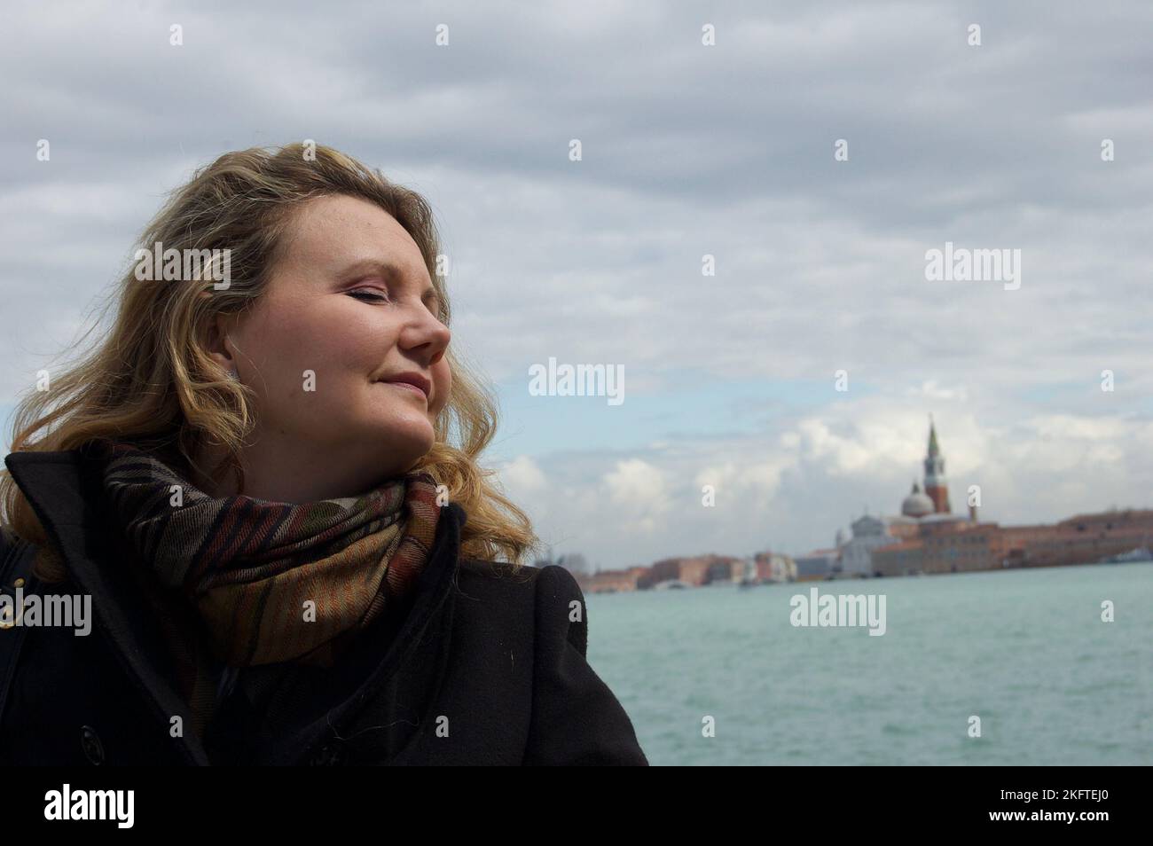 Pretty young woman posing for the camera, smiling blond danish woman ...