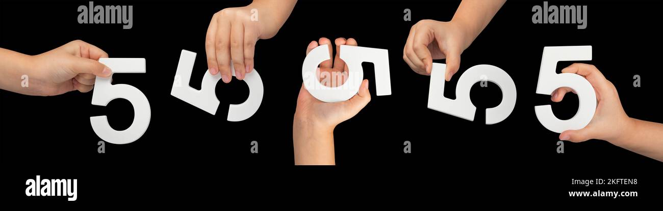 Number five in hand isolated on black background. Number five in the ...