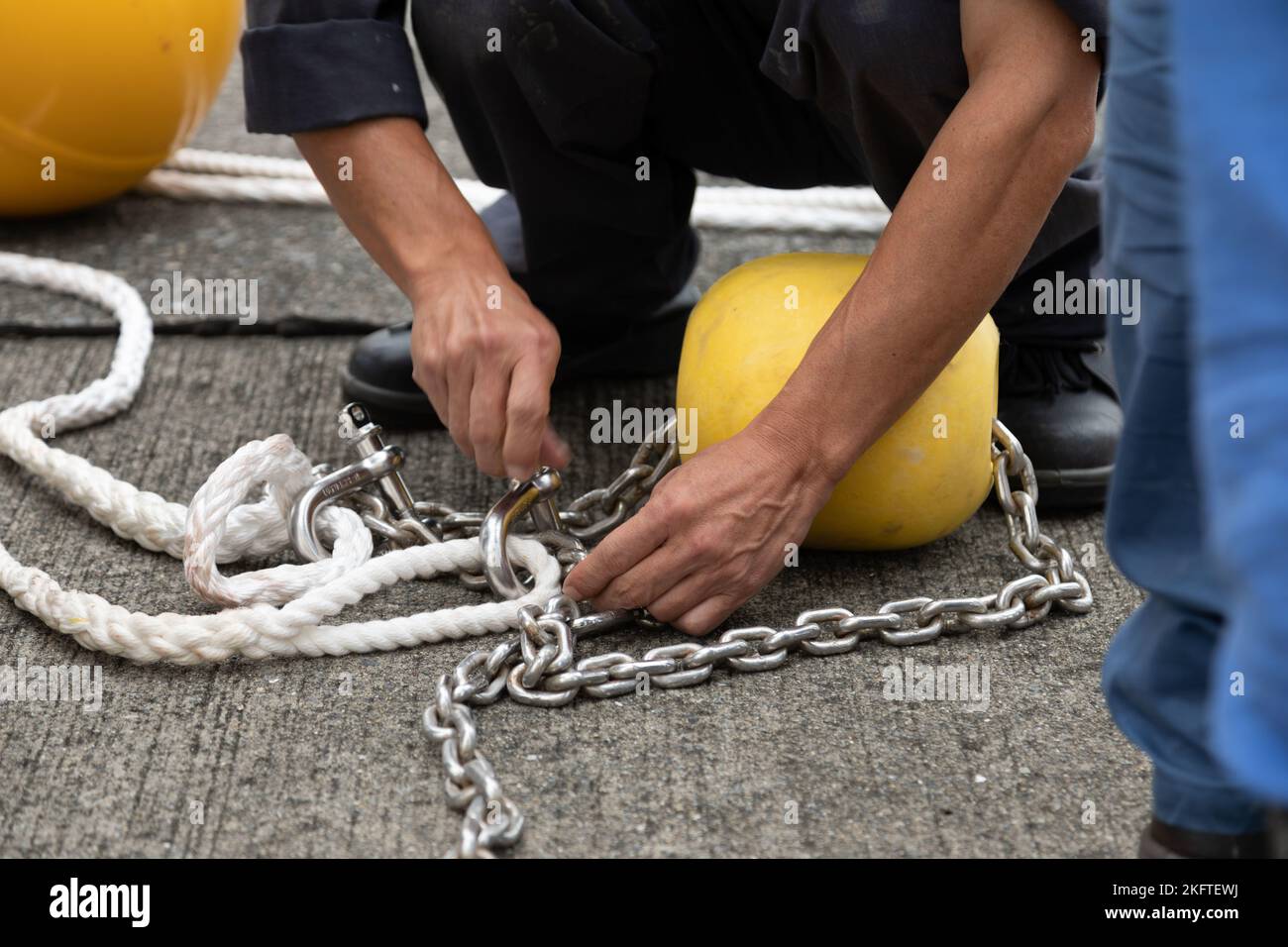 A member of the Japan Maritime Self-Defense Force demonstrates how to ...