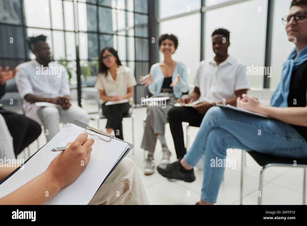 Trainees attending a business team training in a co working space ... Trainees attending a business team training in a co working space ...