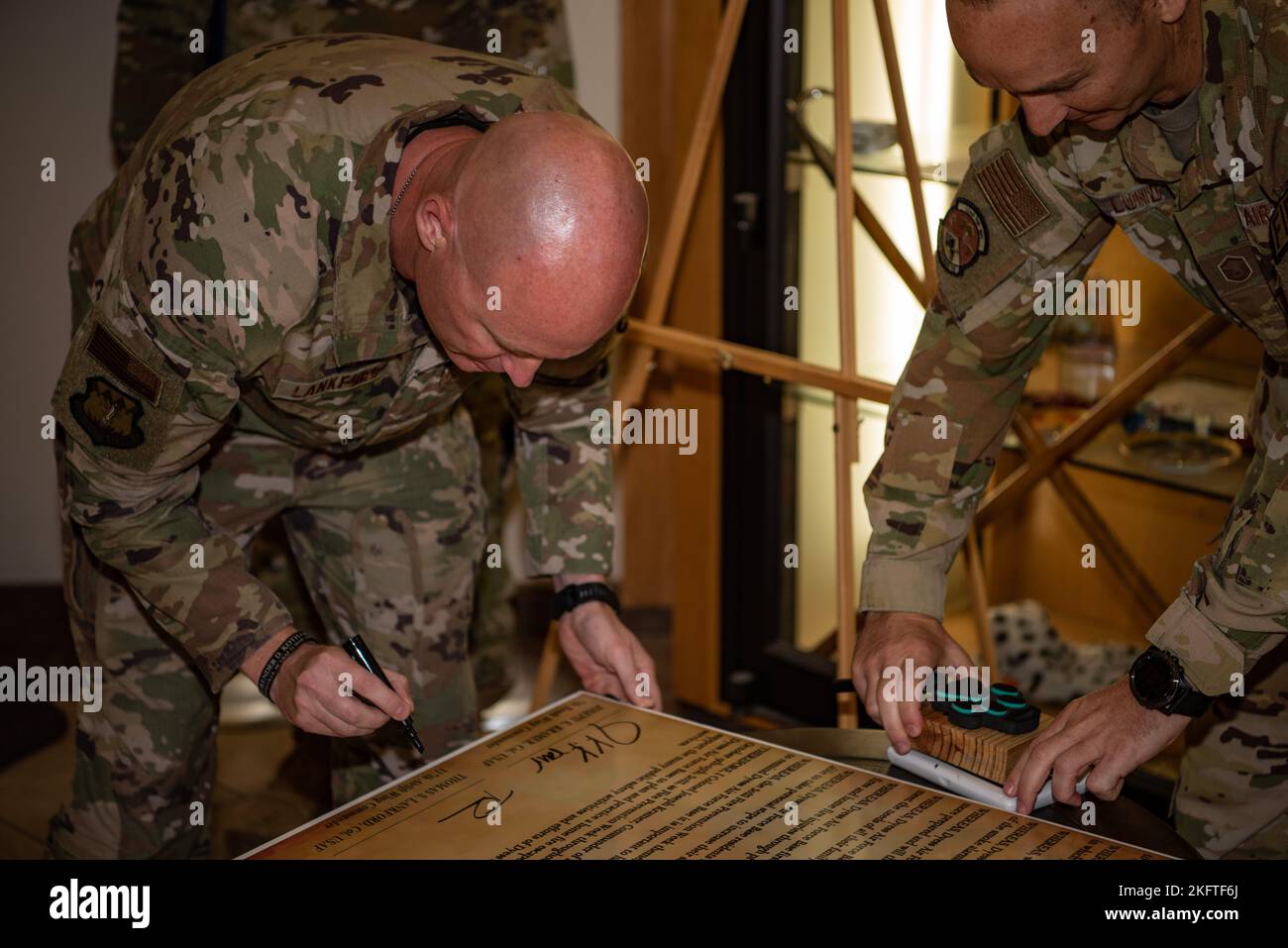 Col. Thomas Lankford, 317th Airlift Wing commander, signs the annual ...