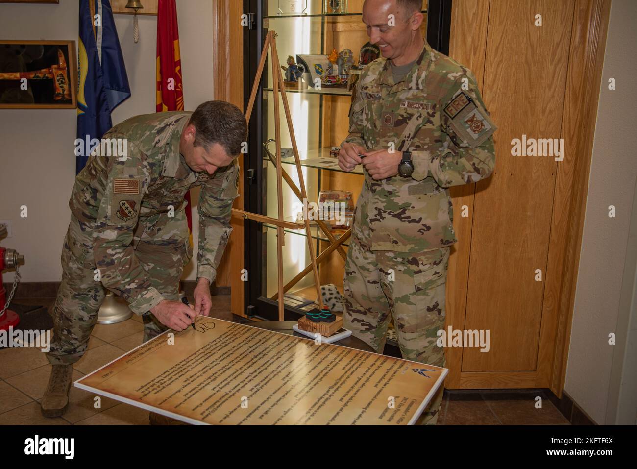 Col. Joseph Kramer, 7th Bomb Wing commander, signs the annual fire ...