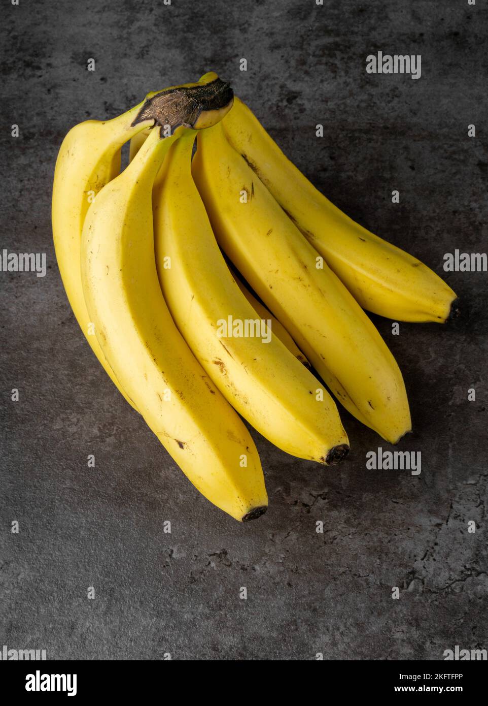 Ripe yellow bananas fruits, bunch of ripe bananas, isolated dark ...