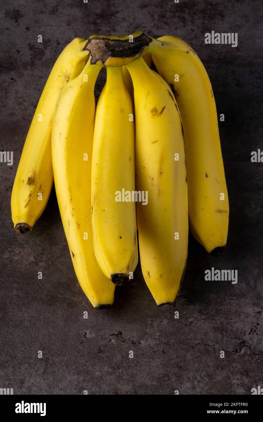 Ripe yellow bananas fruits, bunch of ripe bananas, isolated dark ...