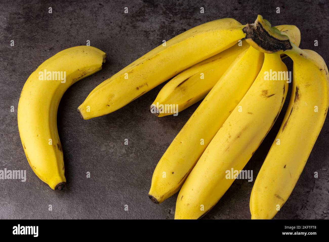 Ripe yellow bananas fruits, bunch of ripe bananas, isolated dark ...
