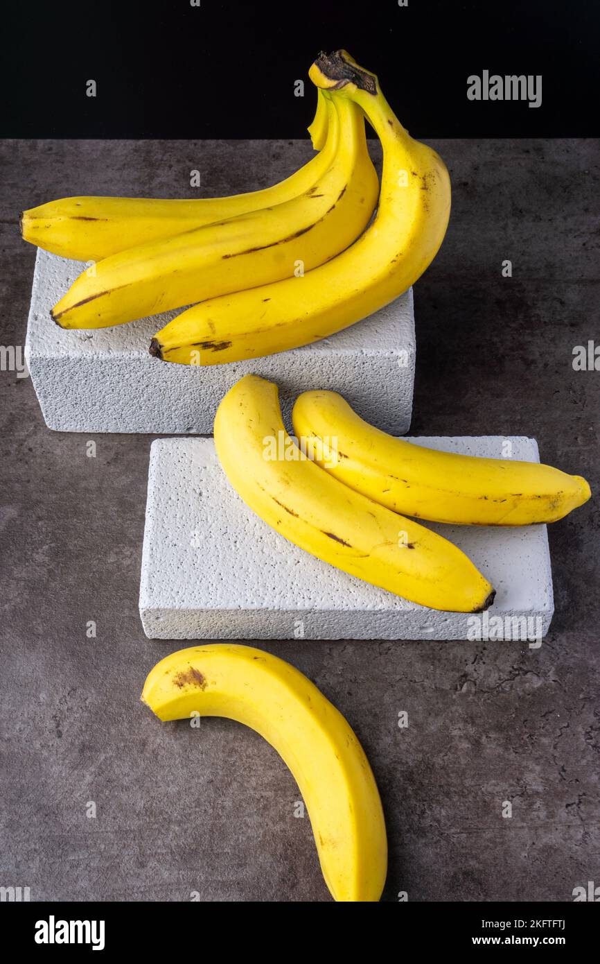Ripe yellow bananas fruits, bunch of ripe bananas, isolated dark ...