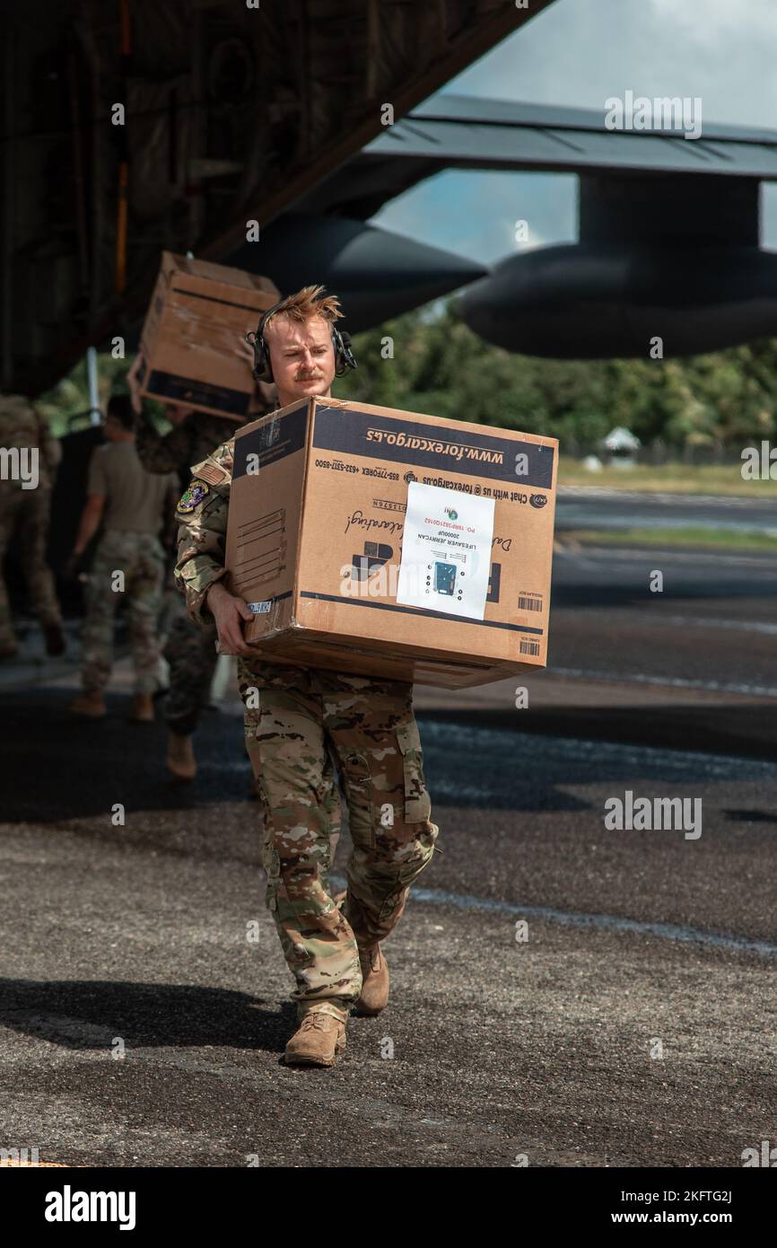 A U.S. Airman with 1st Special Operations Squadron (SOS) offloads a box ...