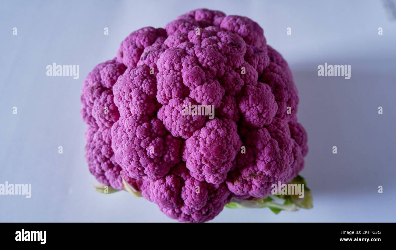 Side view whole violet or purple cauliflower on the white background ...