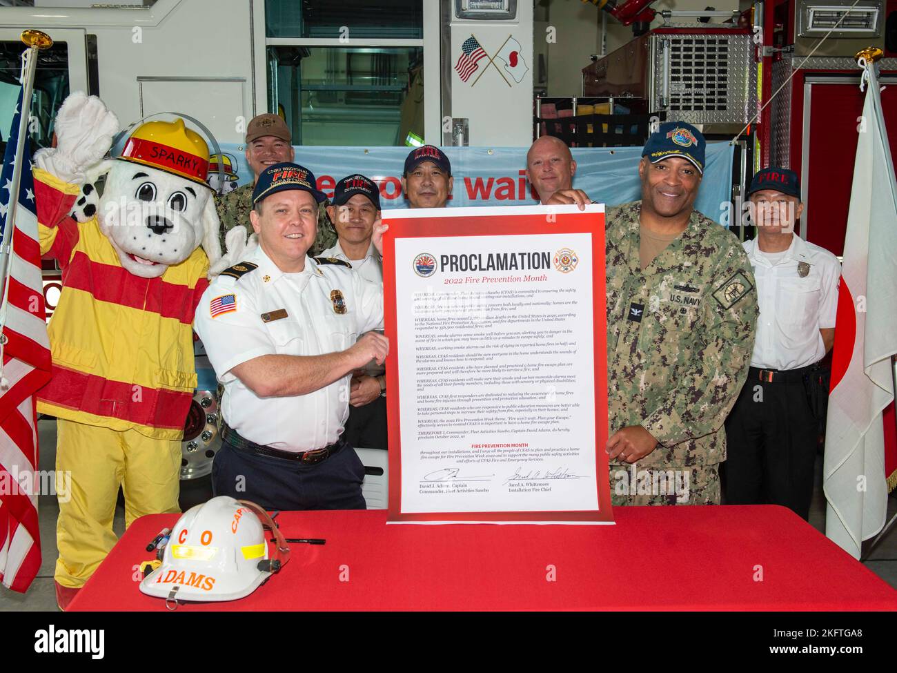 Capt. David Adams, Commander, Fleet Activities Sasebo (CFAS) and Jared ...