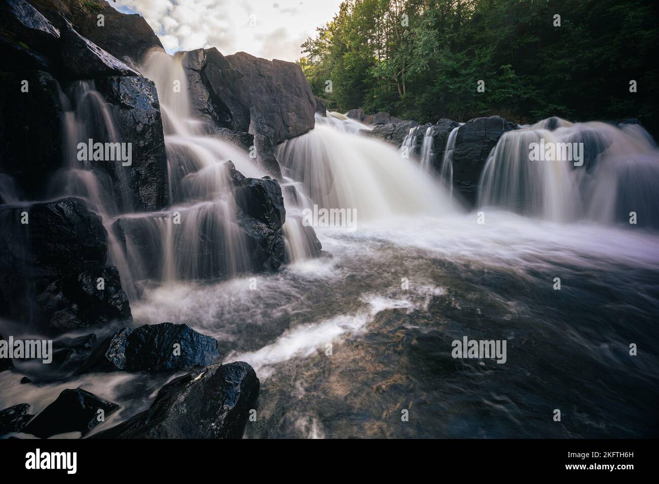 A natural view of the Petawawa River waterfall into Cedar Lake ...