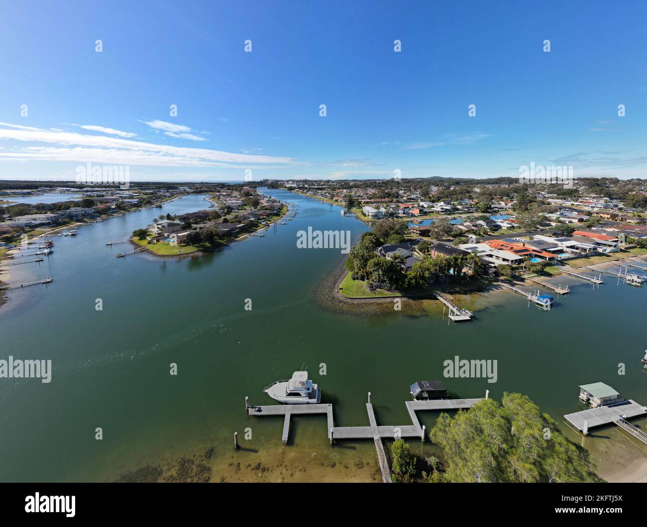 An aerial wide angle view of Hastings River and green Port Macquarie ...