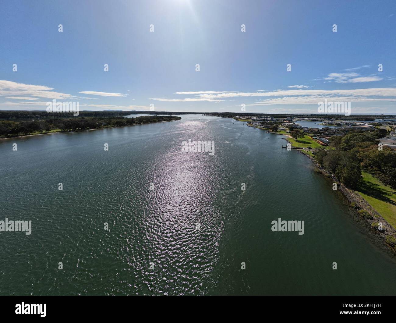 An aerial wide angle view of Hastings River and green Port Macquarie ...