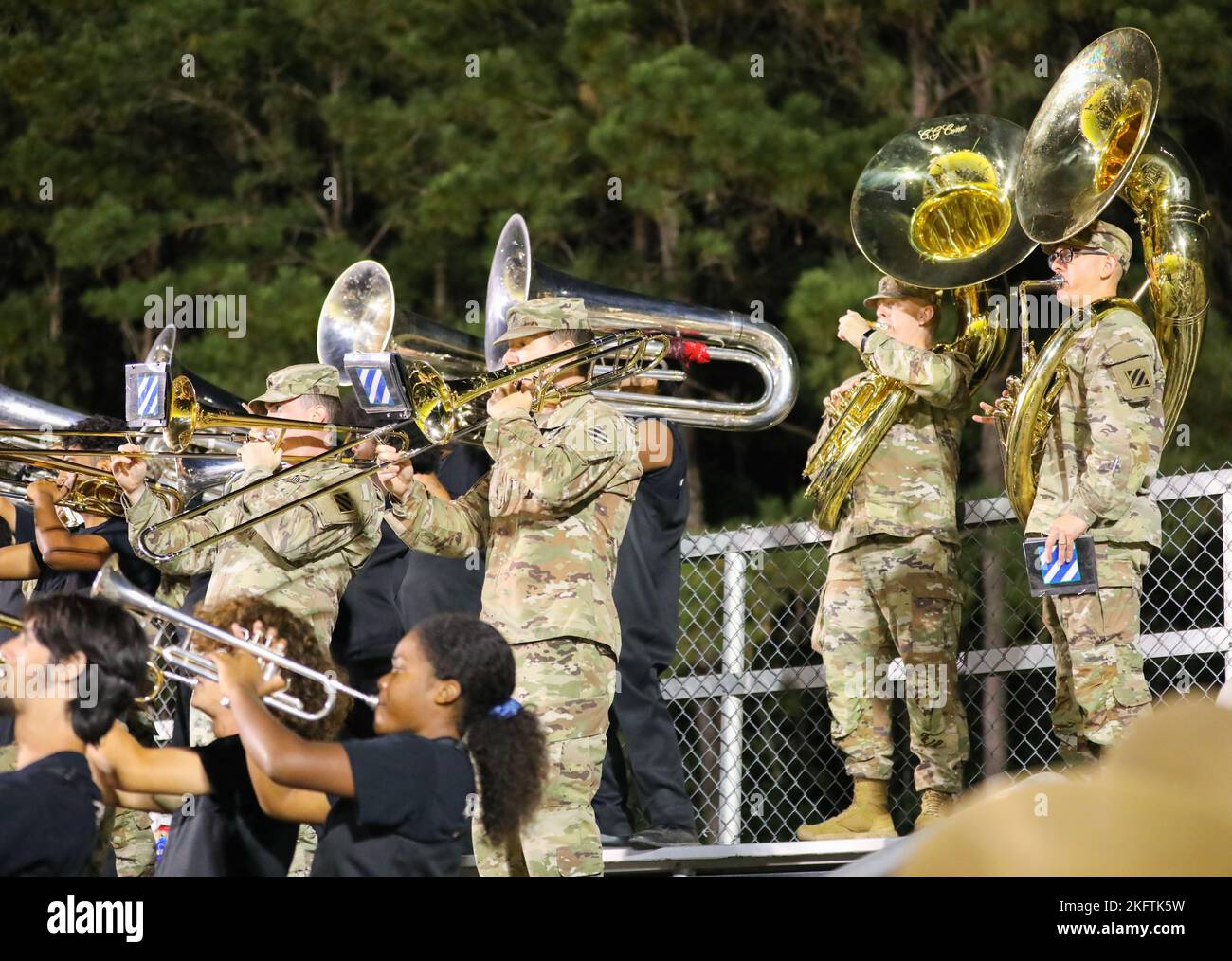 The 3rd Infantry Division Band performs with the Richmond Hill High ...