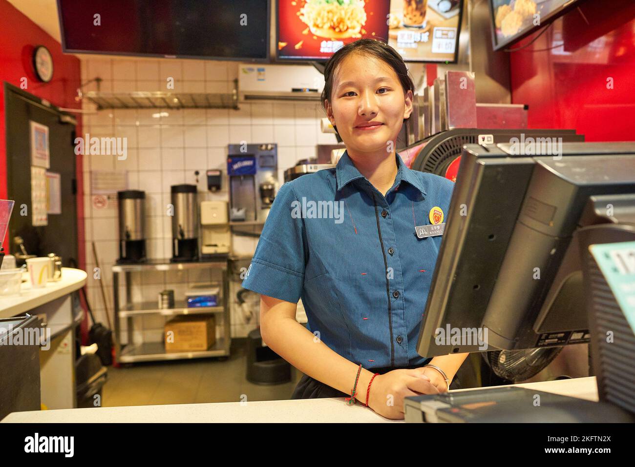 SHENZHEN, CHINA - CIRCA NOVEMBER, 2019: portrait of worker at McDonald ...