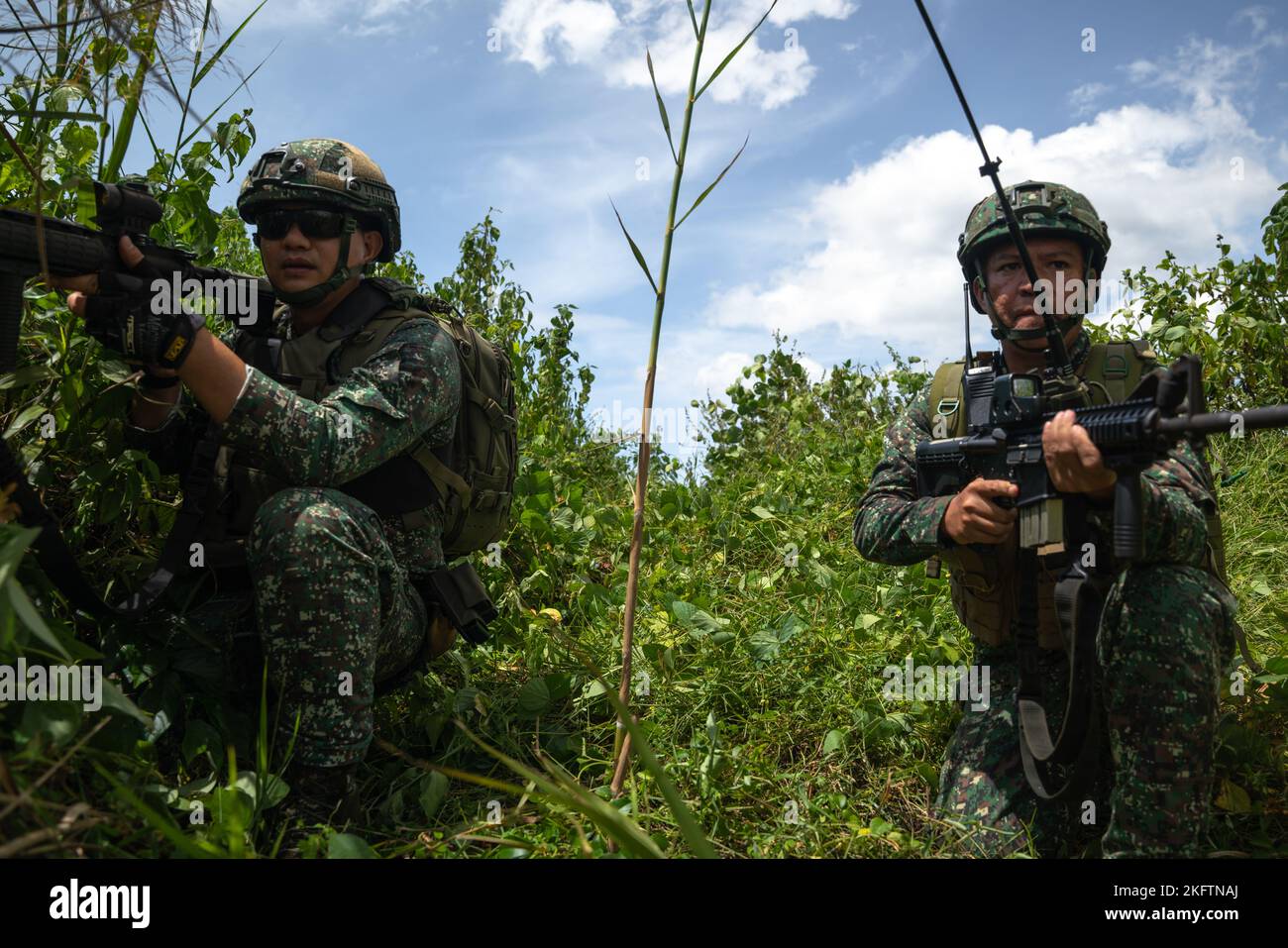 Philippine Marines occupy a fighting position following an amphibious ...