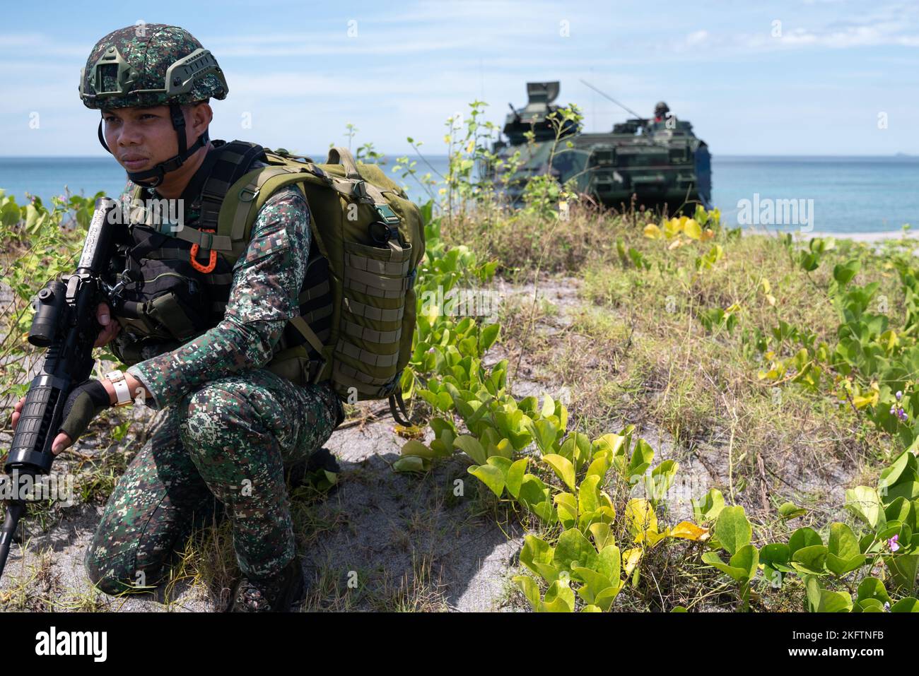 A Philippine Marine provides security for an amphibious landing during ...