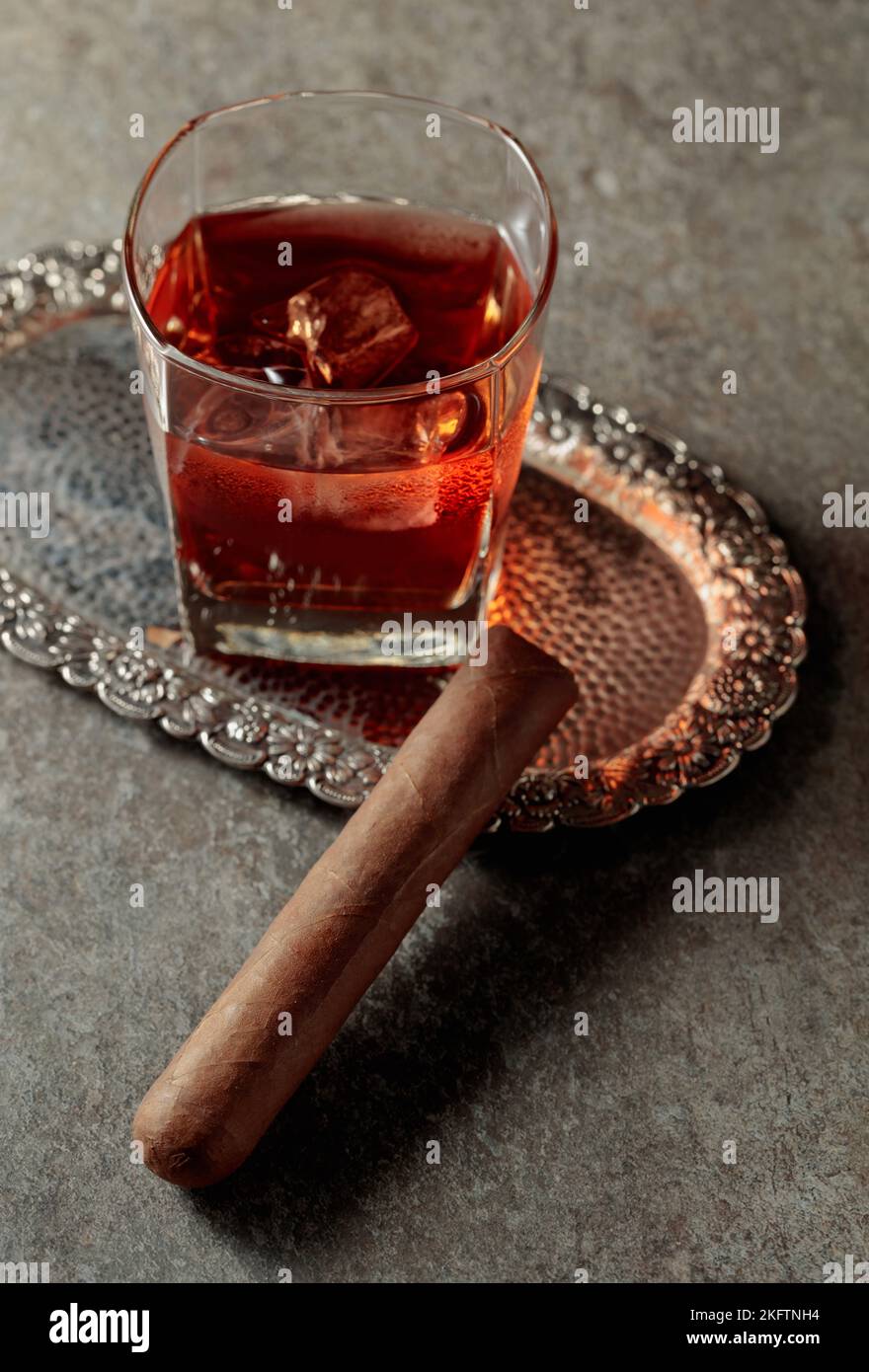 Whiskey with ice and cigar on an old stone table. Copy space Stock ...