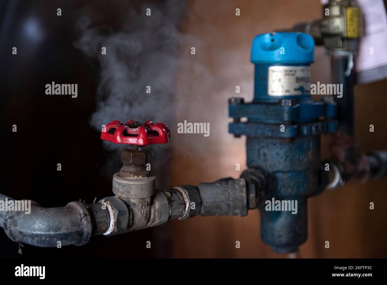 Machinery close up - valve releasing steam Stock Photo - Alamy