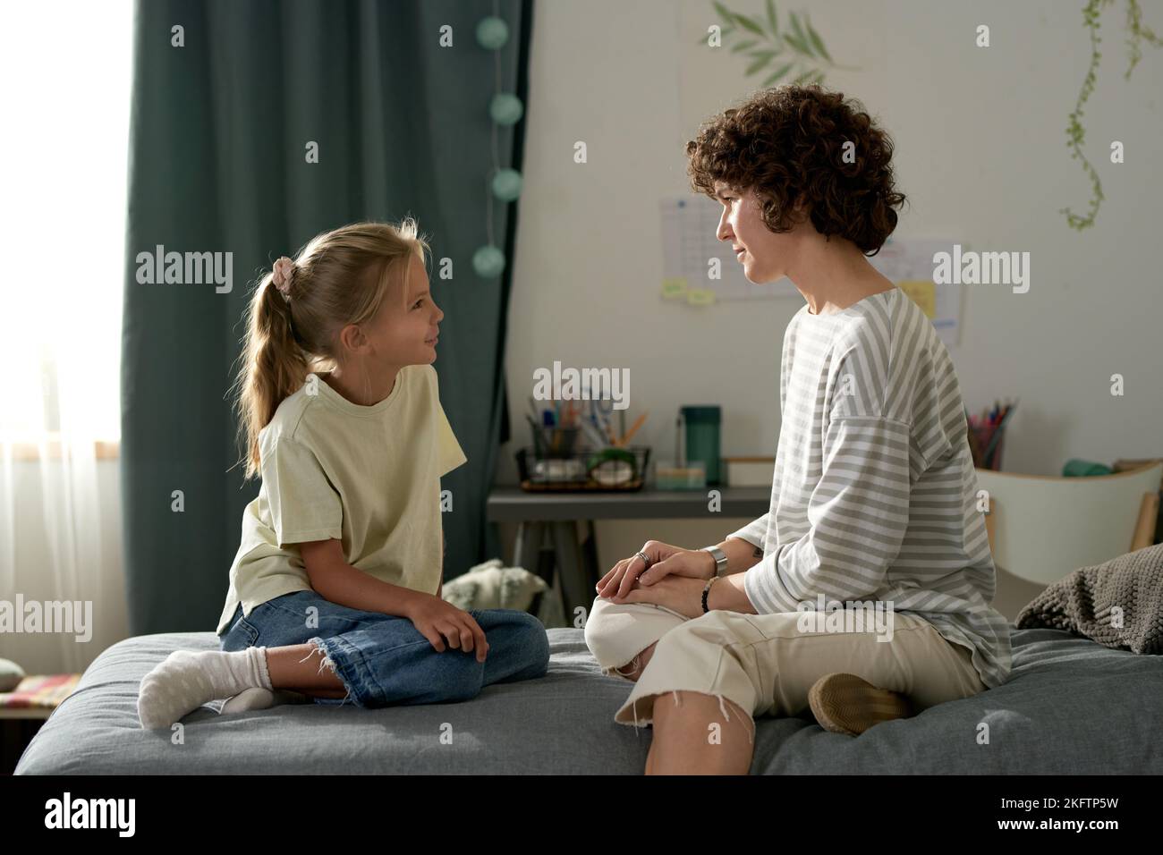 Mother Having Openly Conversation With Her Daughter While They Sitting