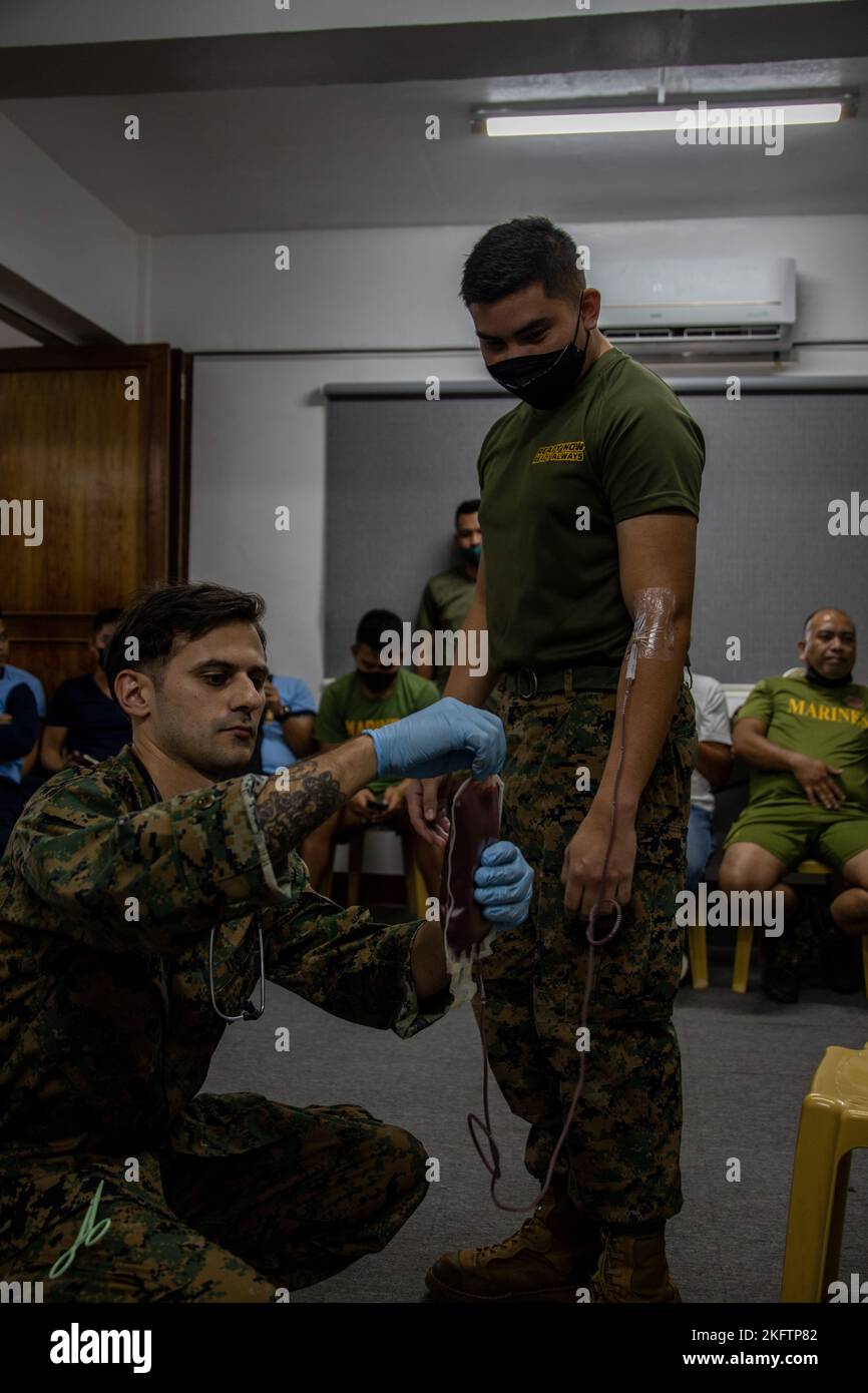 U.S. Navy Hospital Corpsman 2nd Class Joshua Earhart, with 9th Engineer Support Battalion, draws ...
