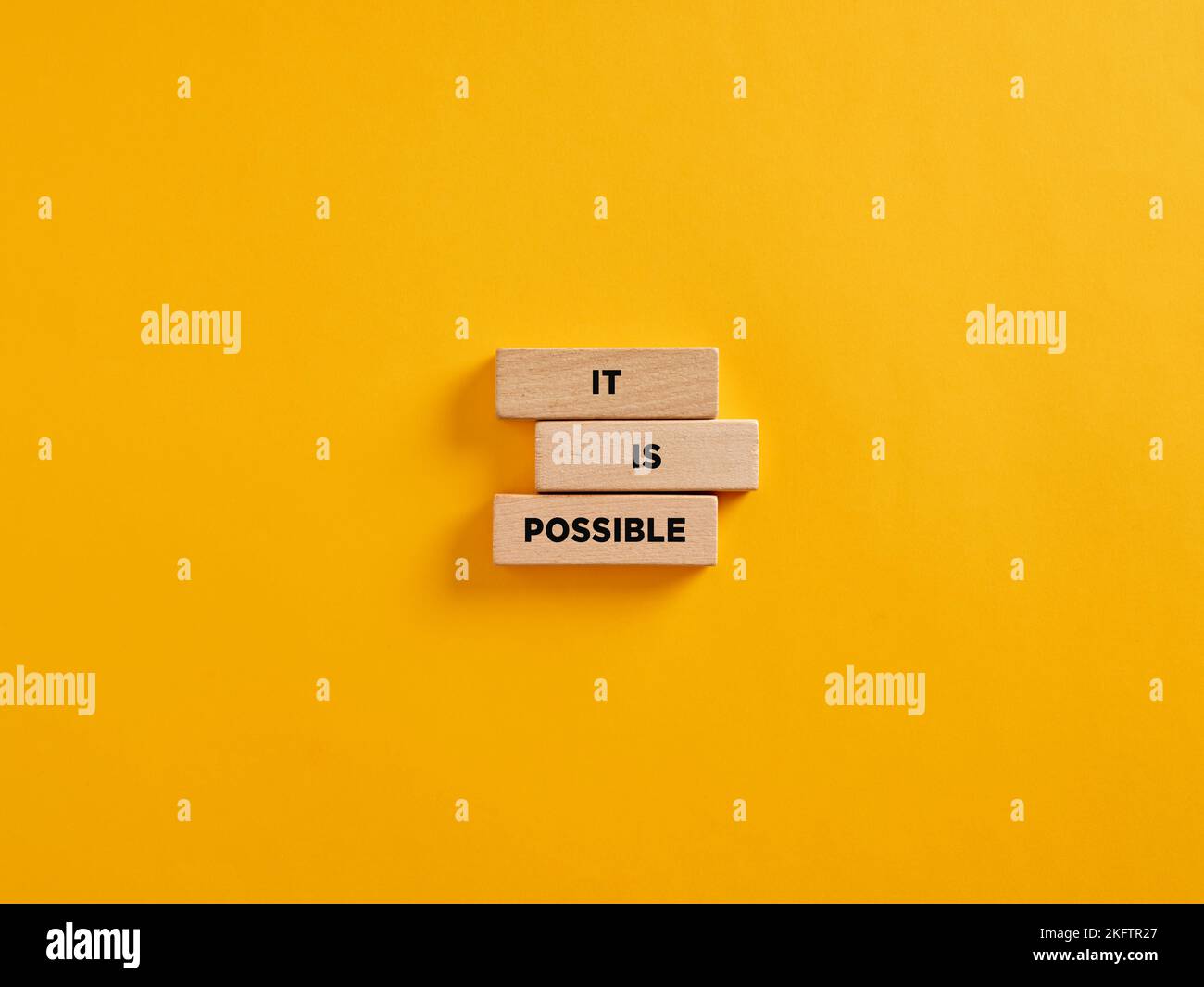 The motivational message it is possible on wooden blocks. Optimism ...
