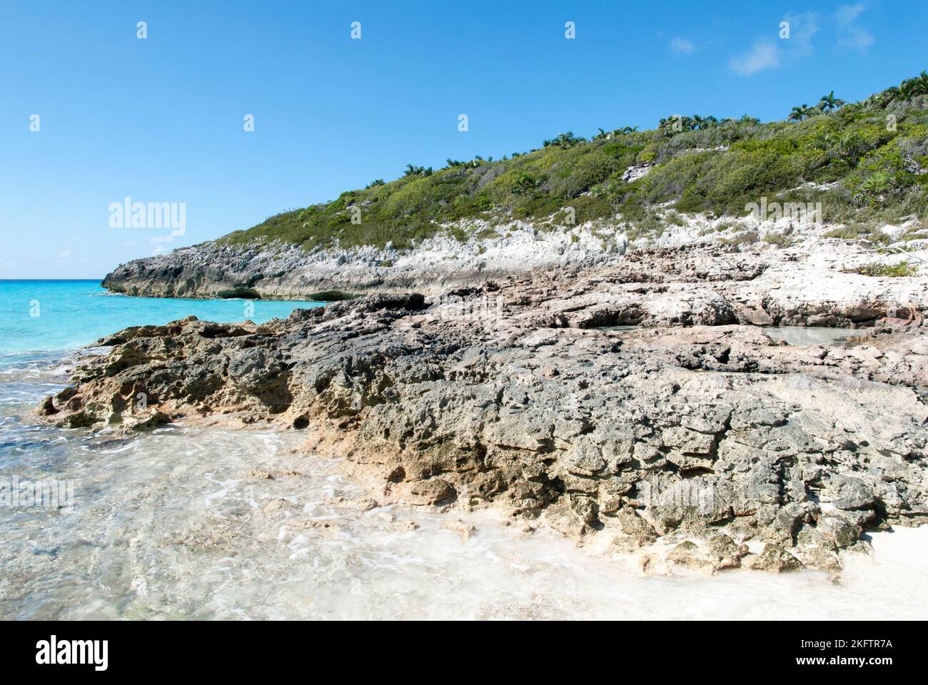 The view of a rocky beach and a coastline on Half Moon Cay uninhabited ...