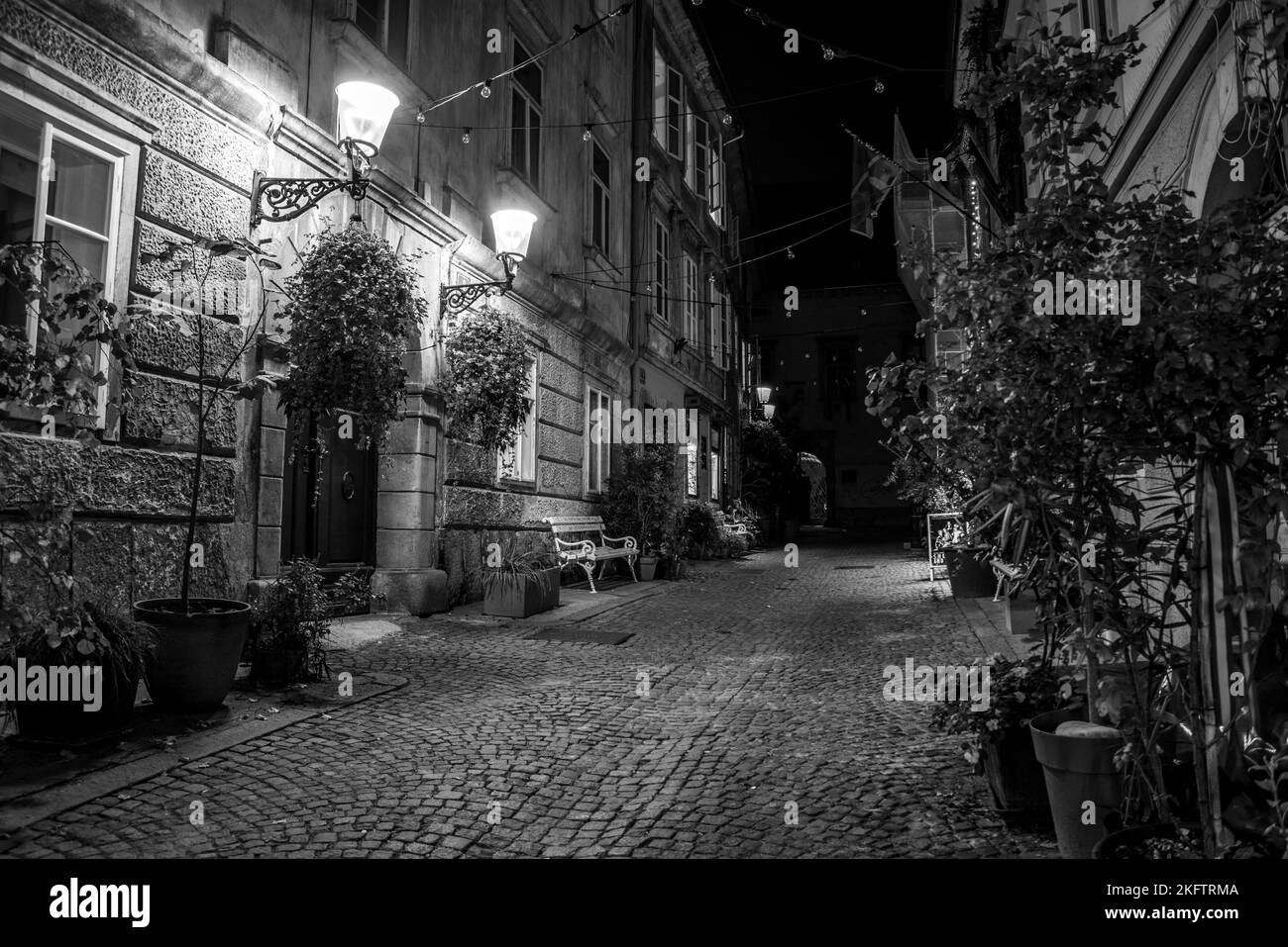 Scenic little Krizevniska alley in Ljubljana illuminated at night ...