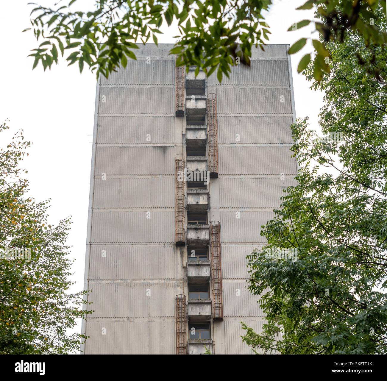 Derelict old fire escape at the facade of a residential building in ...