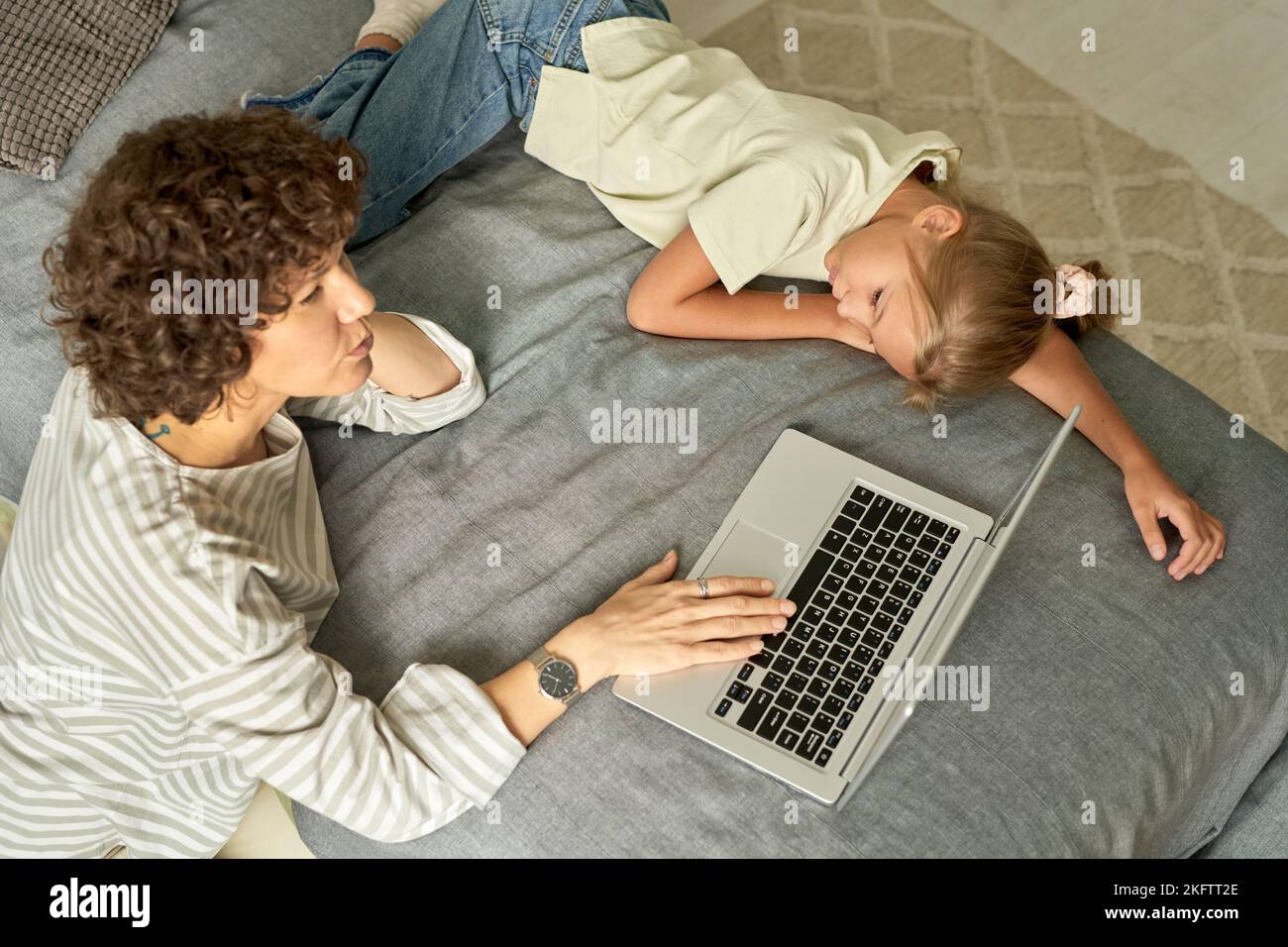 High angle view of mother talking to her little daughter while they ...