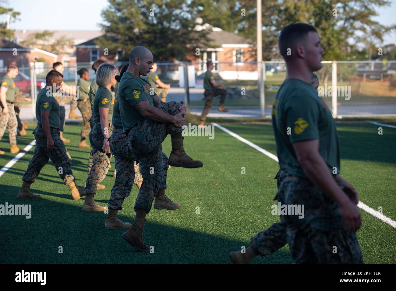 Marines and Sailors stretching prior to competing in the Warrior ...